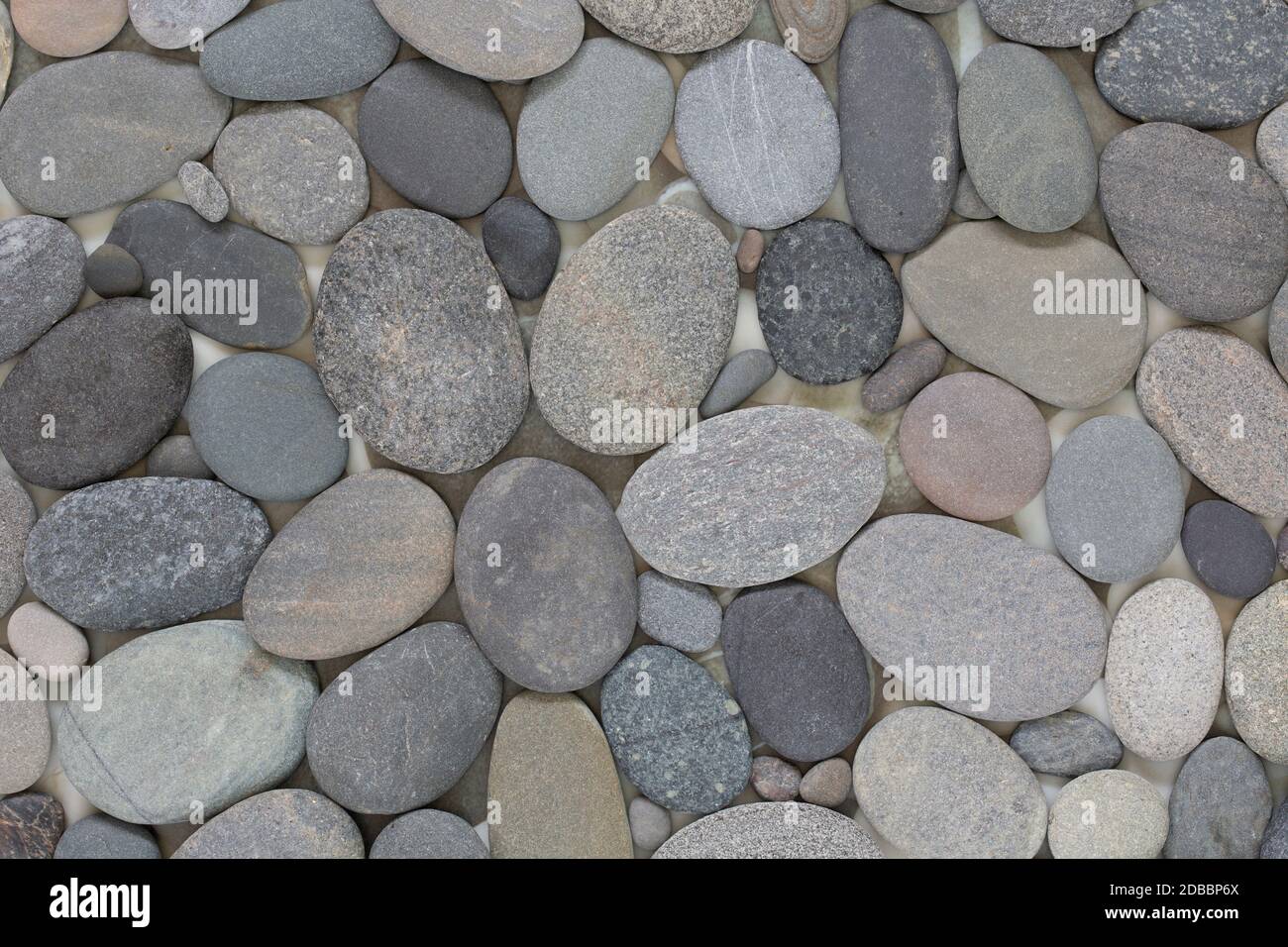 flat lay background of smooth grey pebble Stock Photo - Alamy