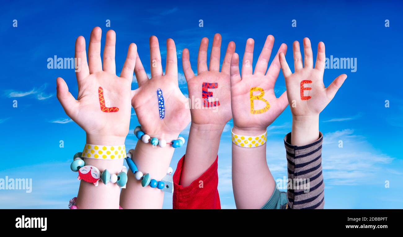 Children Hands Building Colorful German Word Liebe Means Love. Blue Sky ...