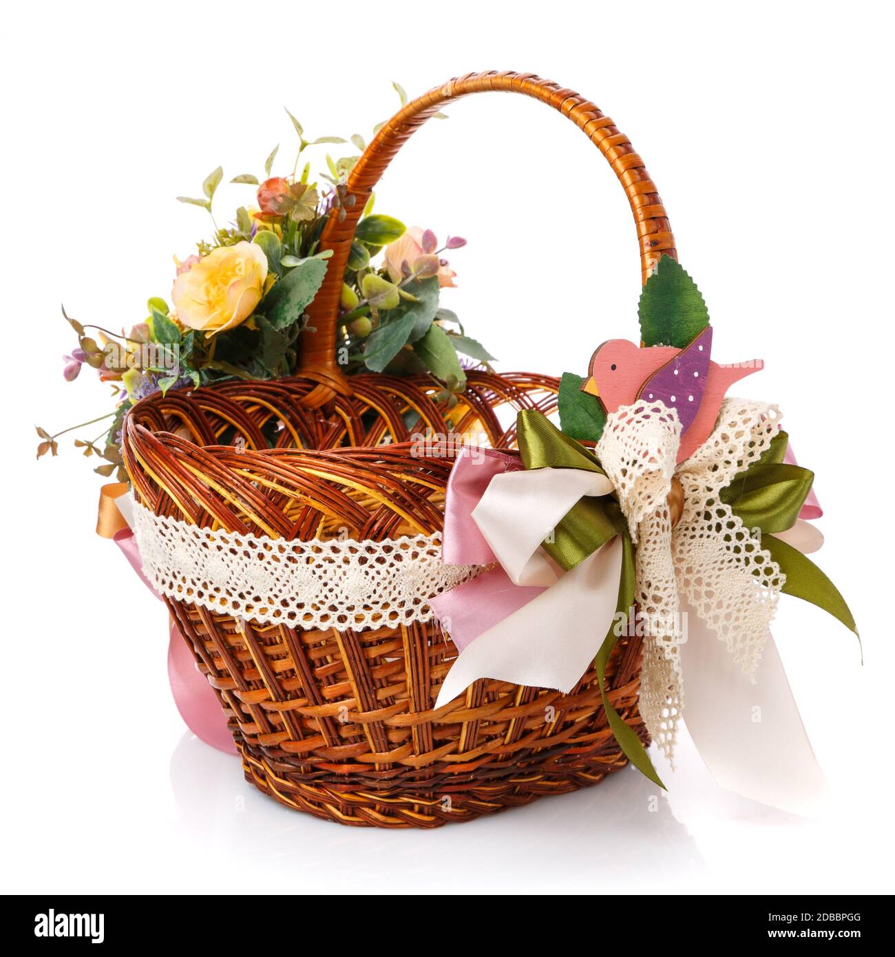 Easter basket. Brown wicker basket with colorful floral decor and ...