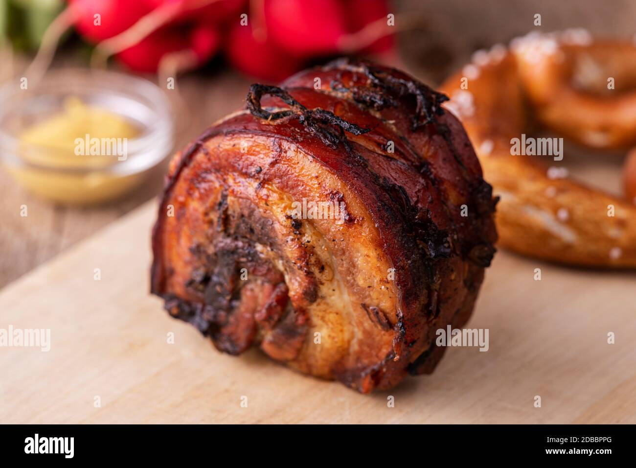 grilled rolled pork on a cutting board Stock Photo - Alamy