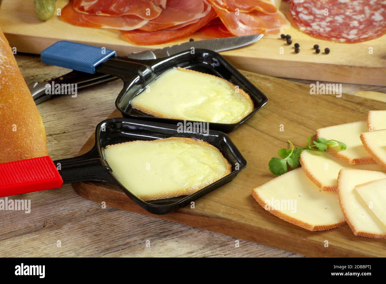 raclette cheese on a table Stock Photo - Alamy