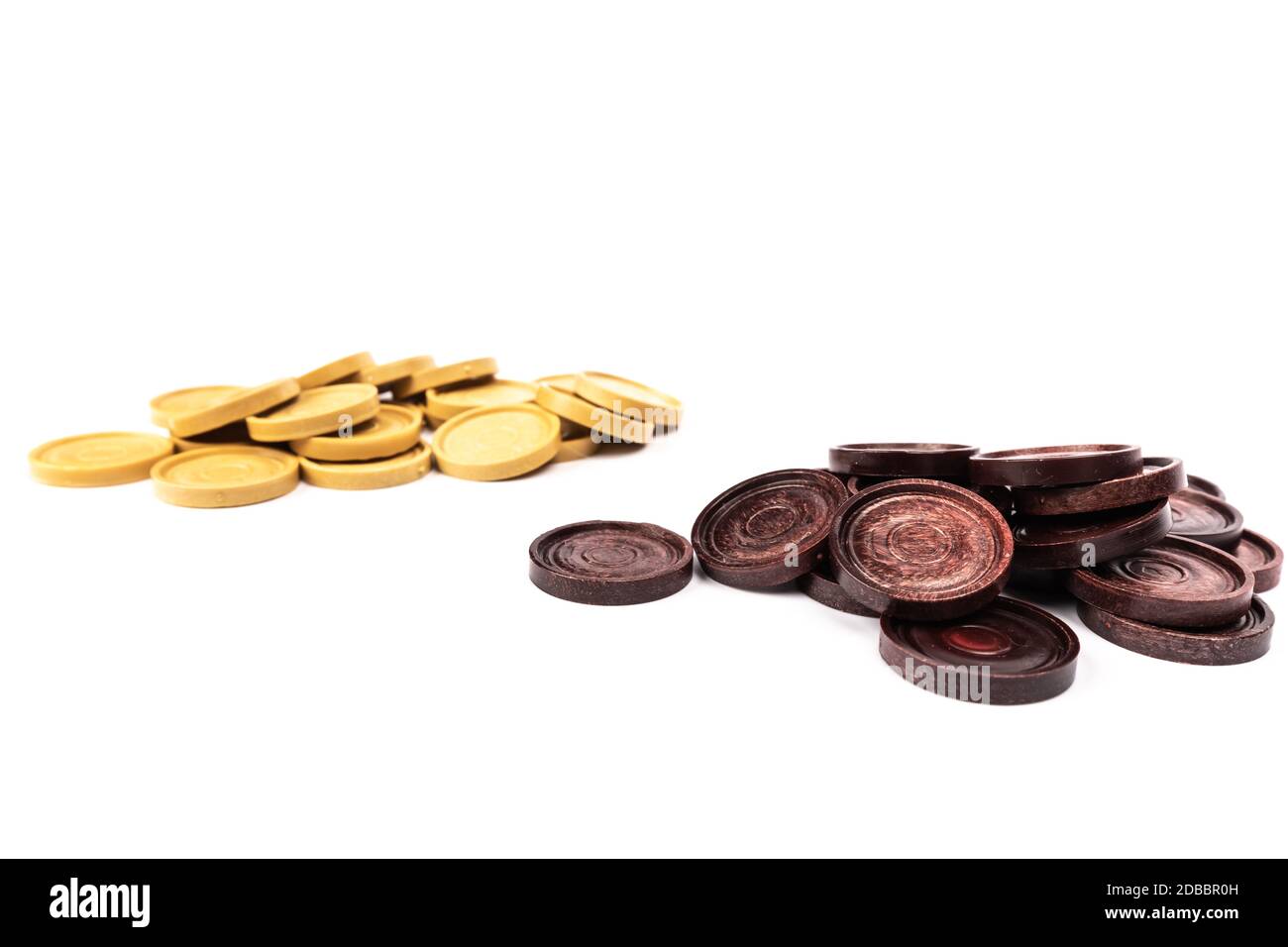 low-end plastic round checkers piece in white background in studio ...