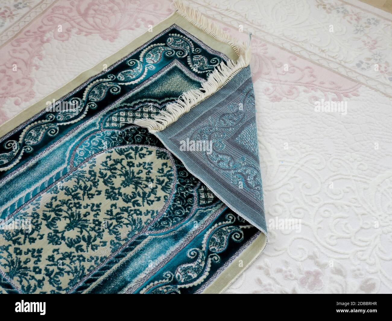 Muslims are praying on prayer rugs, green prayer rug and ramadan month ...