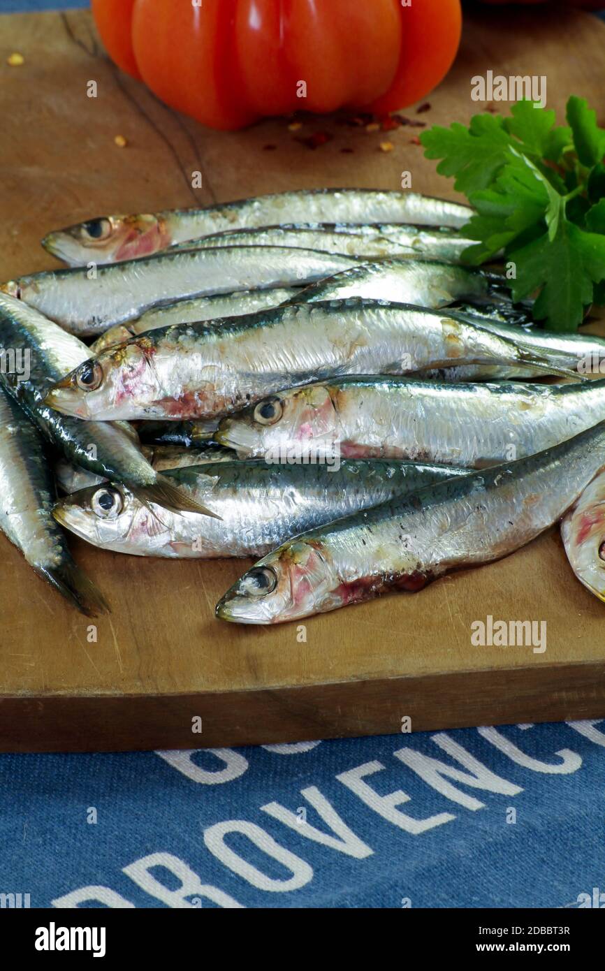 Cutting sardines hi-res stock photography and images - Alamy