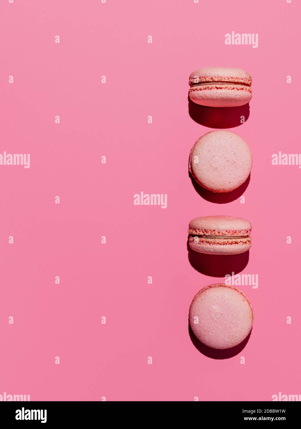 Pink macarons with copy space. Row of perfect french macarons or ...