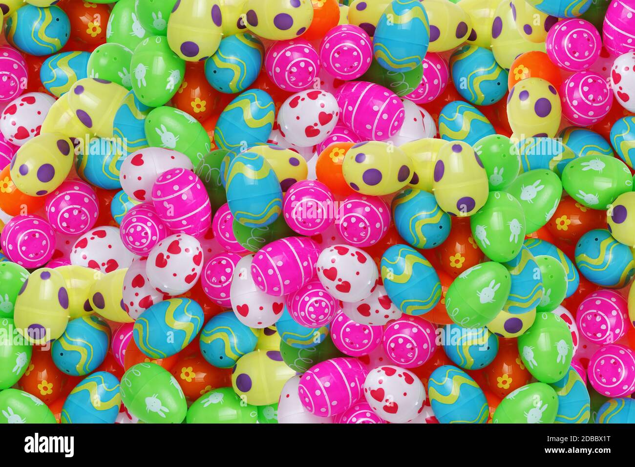 A childs plastic toy easter eggs background Stock Photo - Alamy
