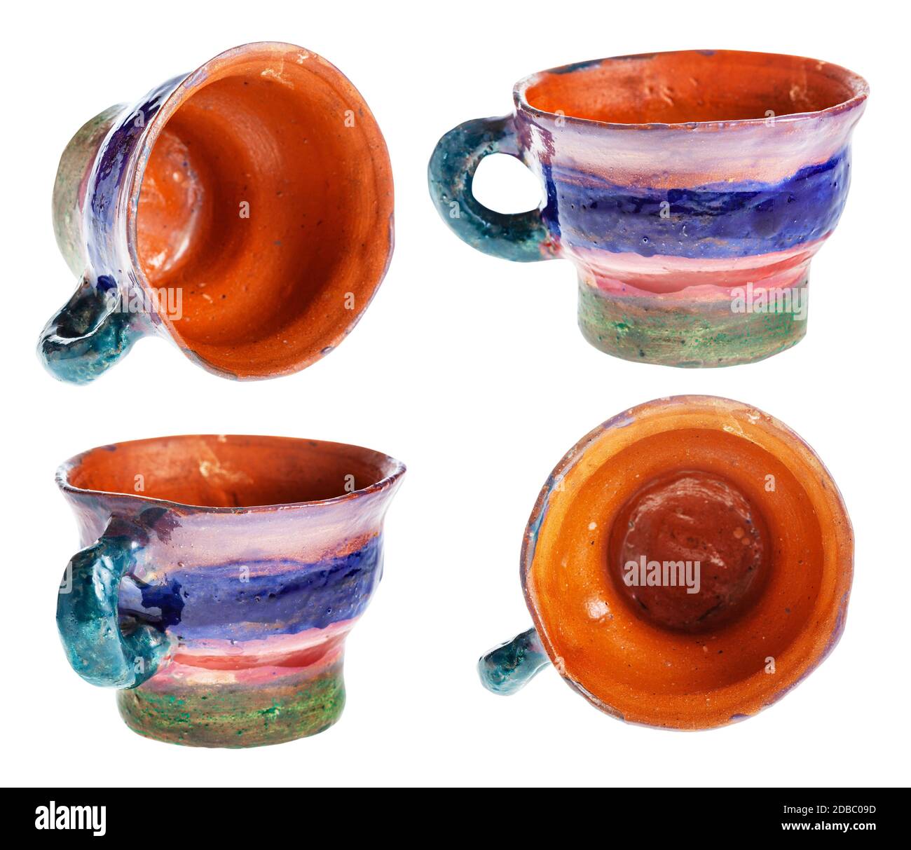 set from handmade and handpainted cups from red clay isolated on white ...