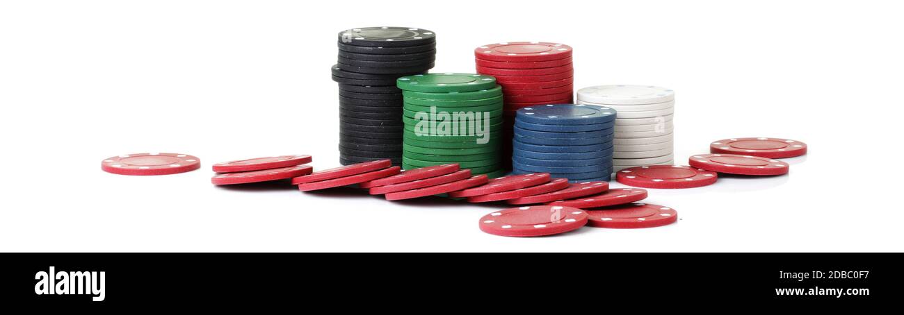 Piles of casino betting chips on white background Stock Photo - Alamy