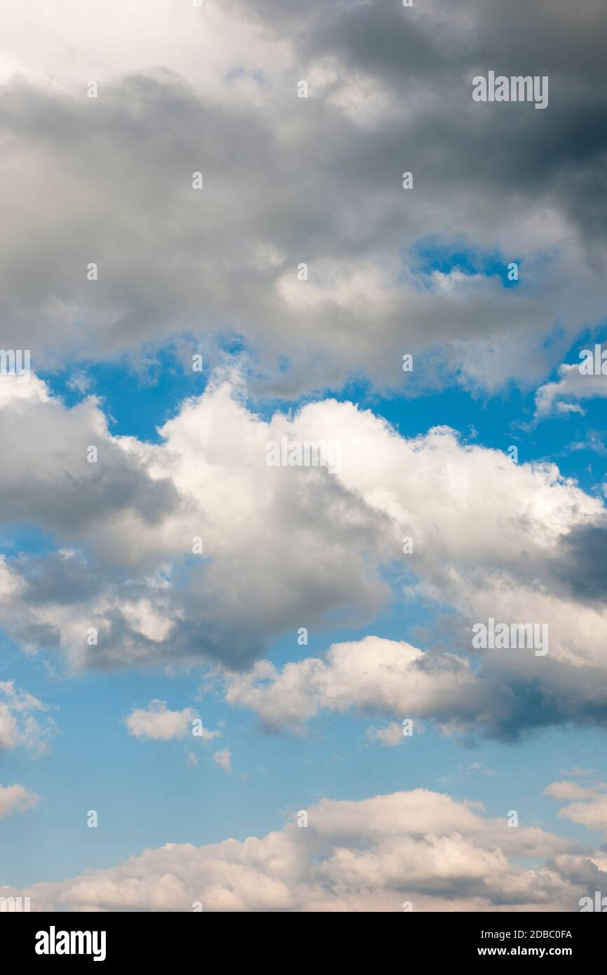 Dramatic cloud formation with translucent blue skies in between ...
