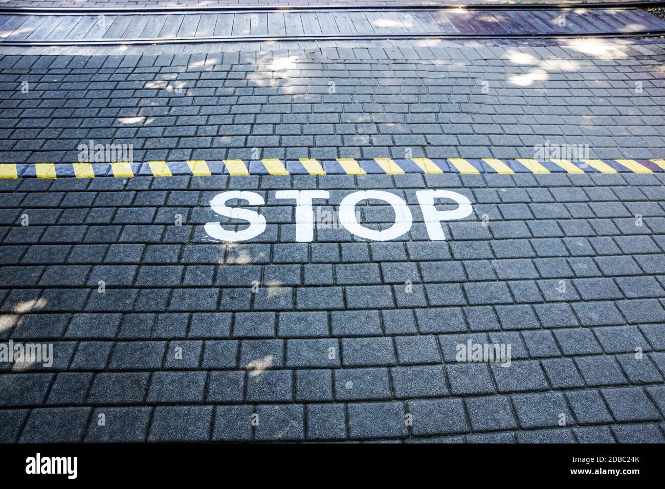 Stop written on floor asphalt concept image Stock Photo - Alamy