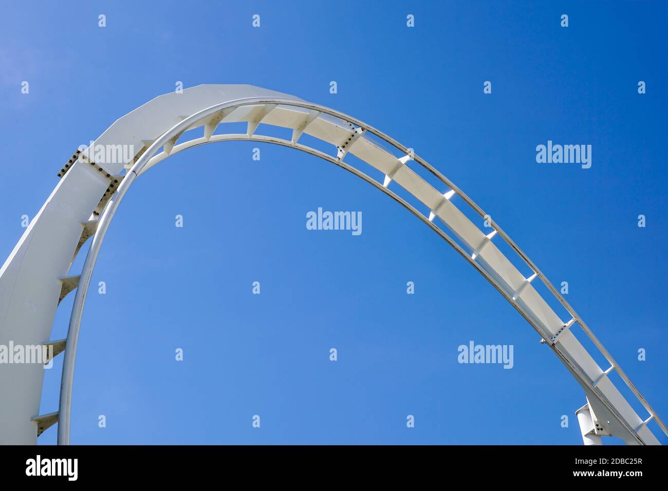 Rollercoaster track against a brilliant blue sky Stock Photo - Alamy
