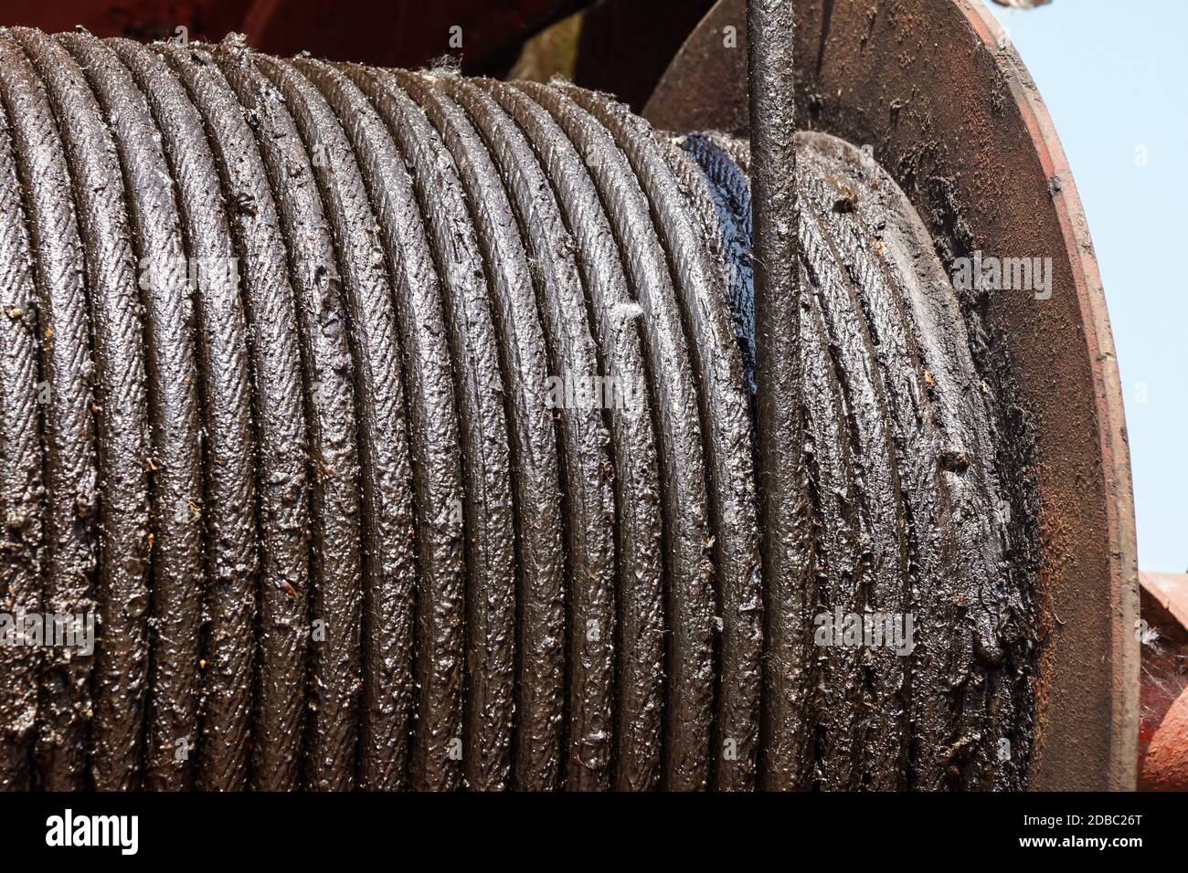 Detail of a big winch winding a steel cable Stock Photo - Alamy