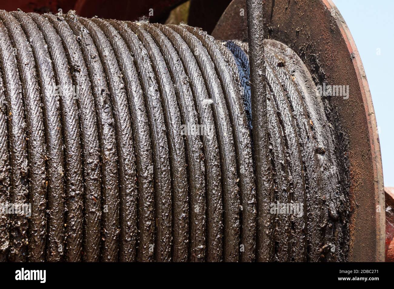 Detail of a big winch winding a steel cable Stock Photo - Alamy