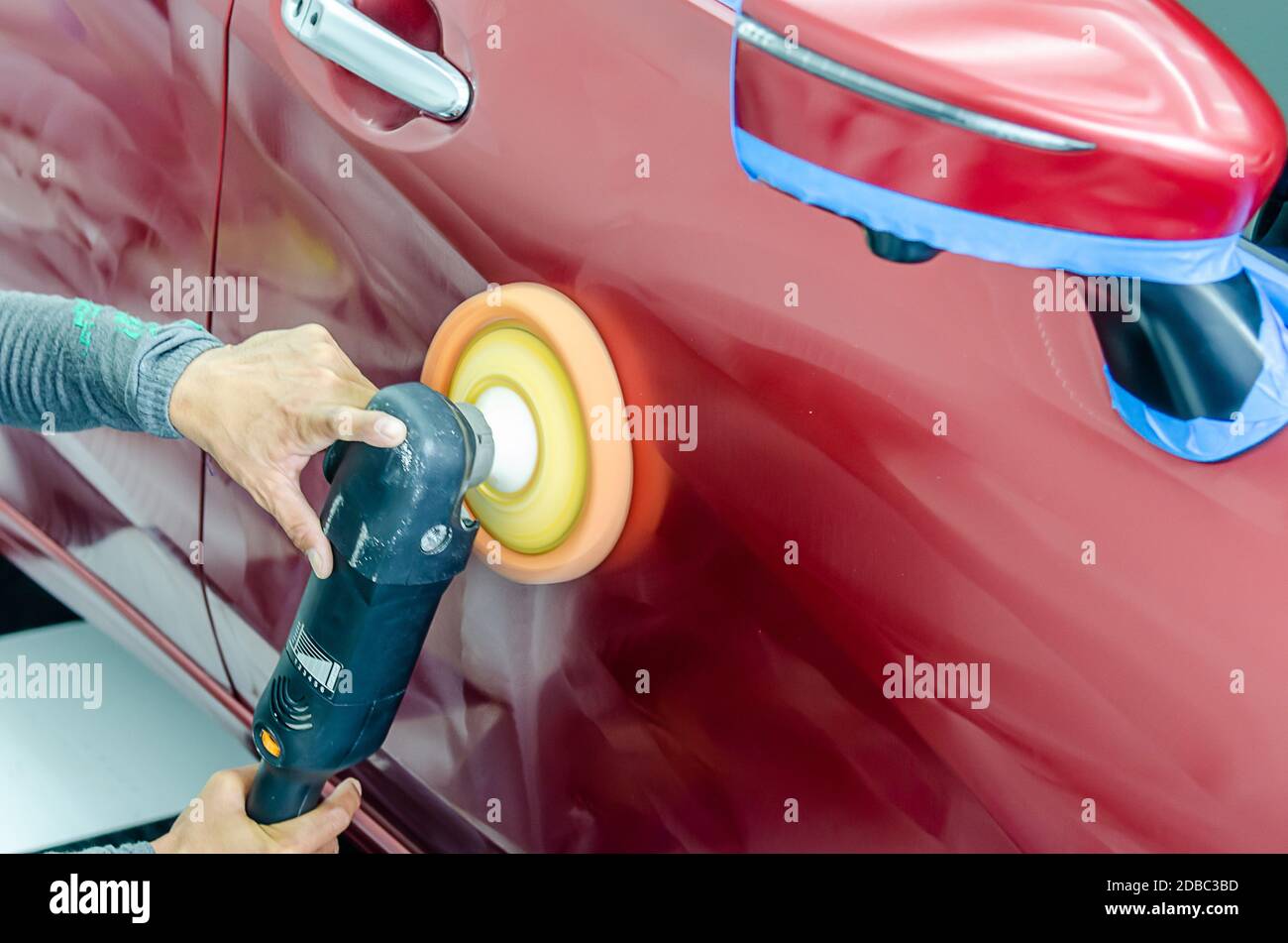 Auto polishing with machine.car polish to remove and recover the car ...