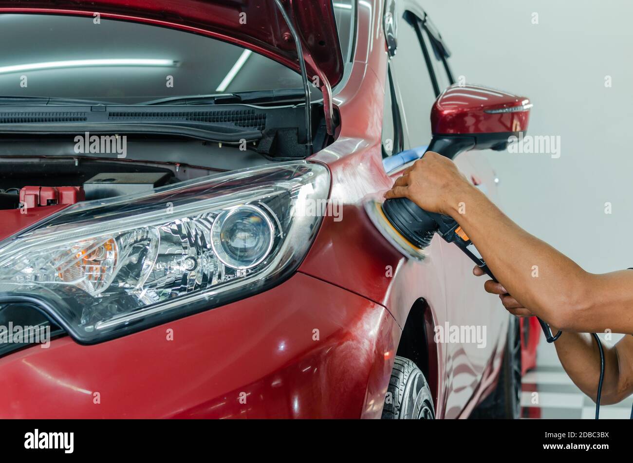 Auto polishing with machine.car polish to remove and recover the car ...