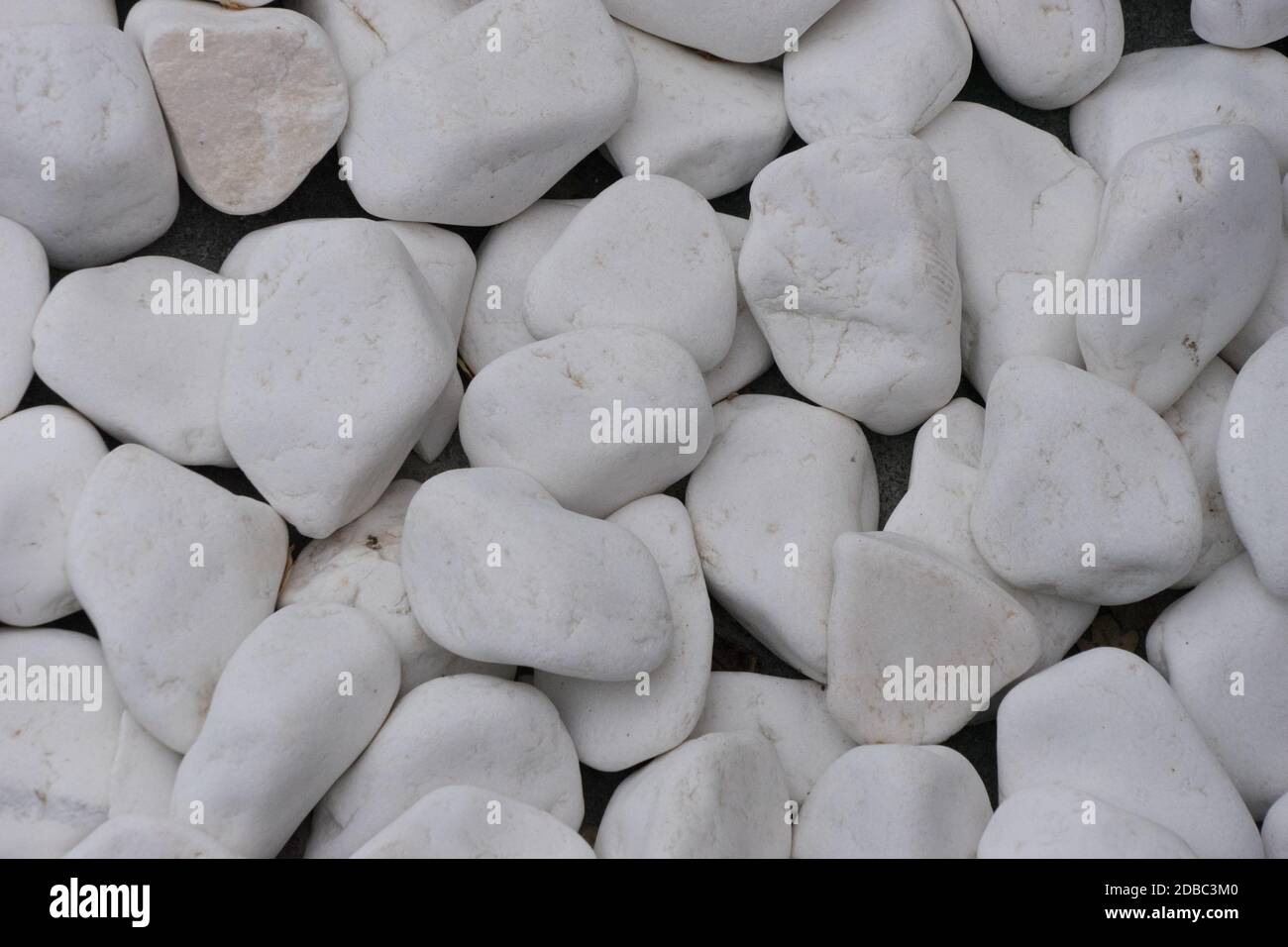 White stones background material texture Stock Photo - Alamy