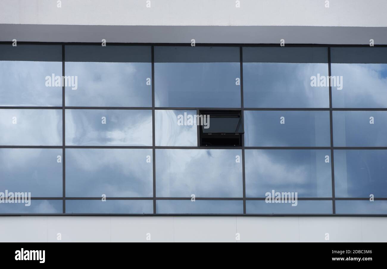Clouds mirror reflection in a modern glass architecture Stock Photo - Alamy