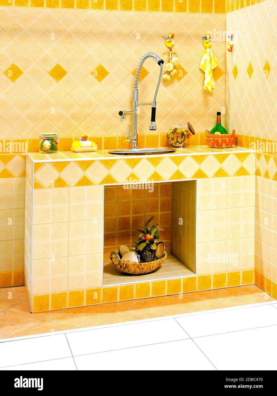 Interior shot of kitchen with orange tiles Stock Photo - Alamy