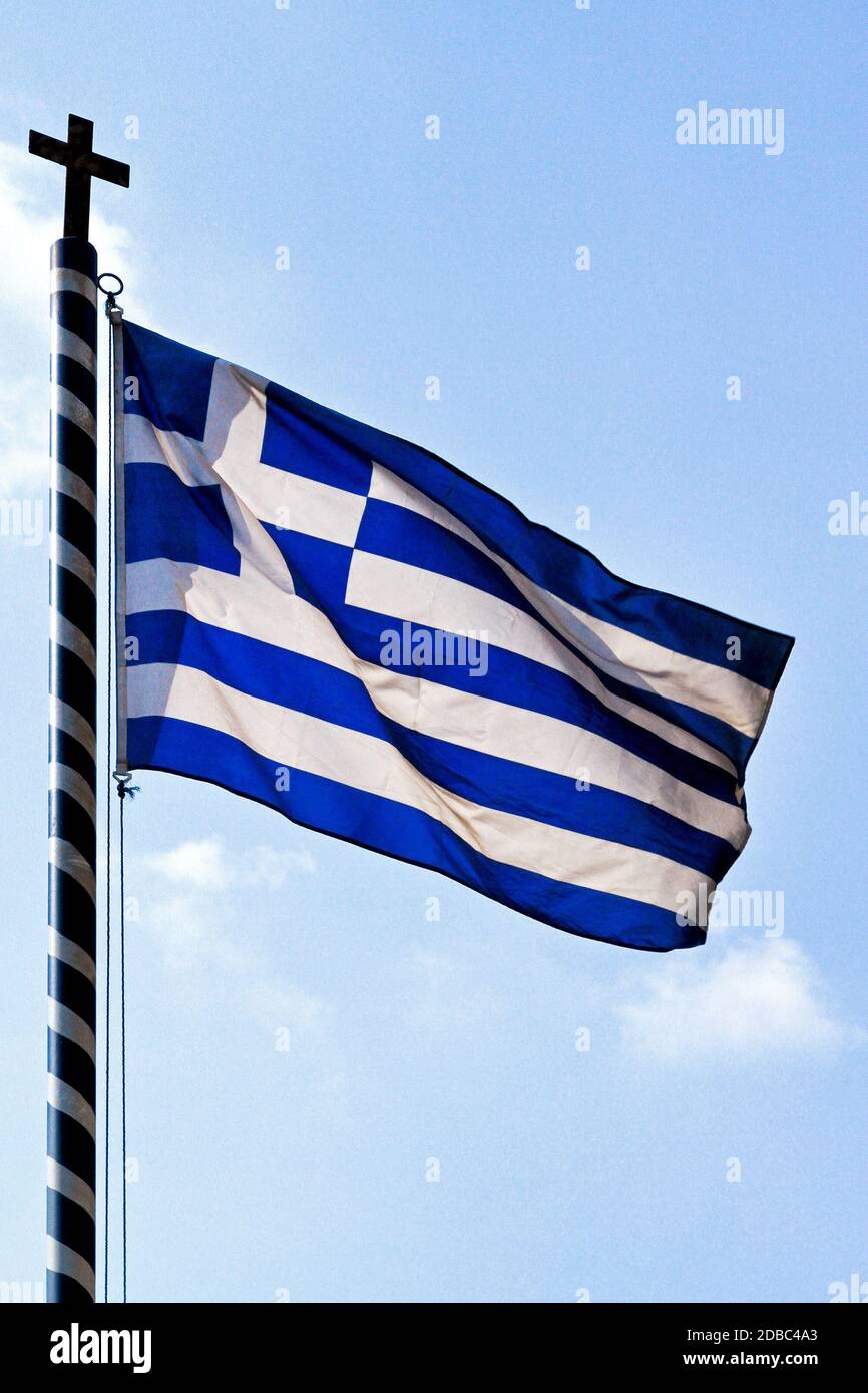 Greece flag at pole with church cross Stock Photo - Alamy