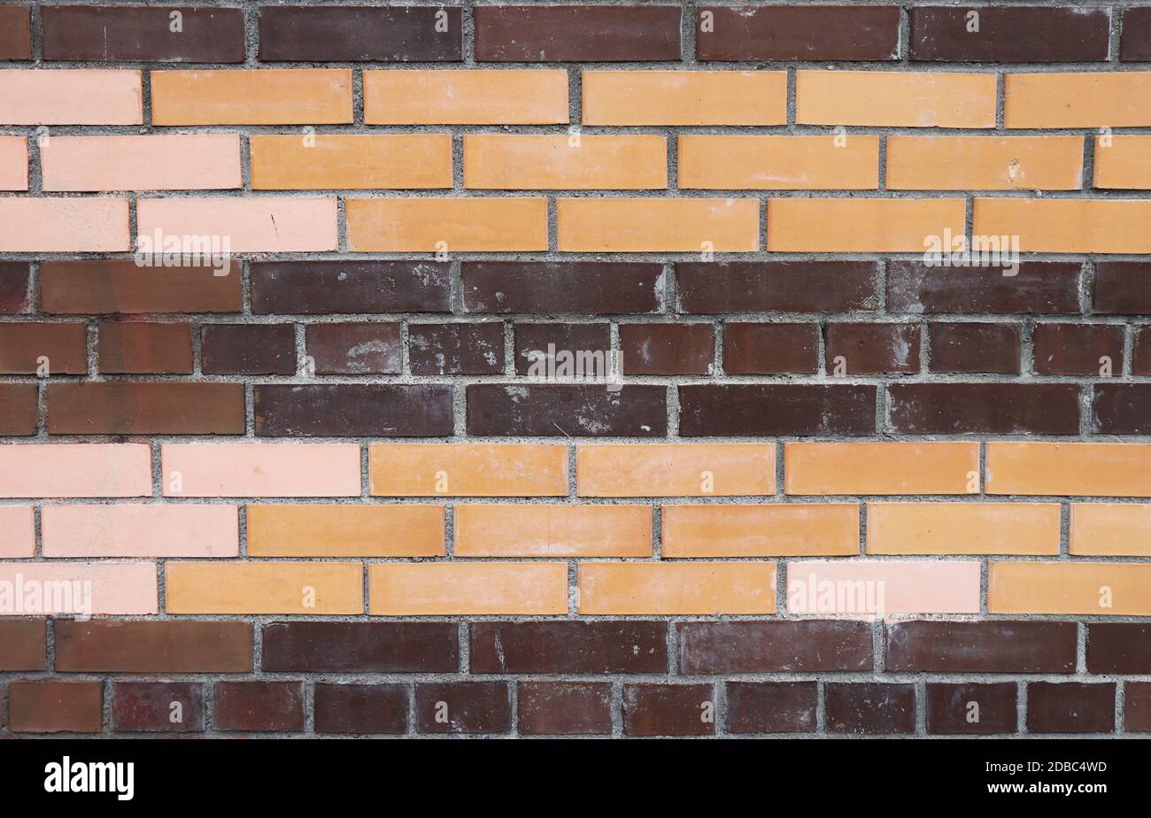 Colored bricks wall texture with cement stains Stock Photo - Alamy
