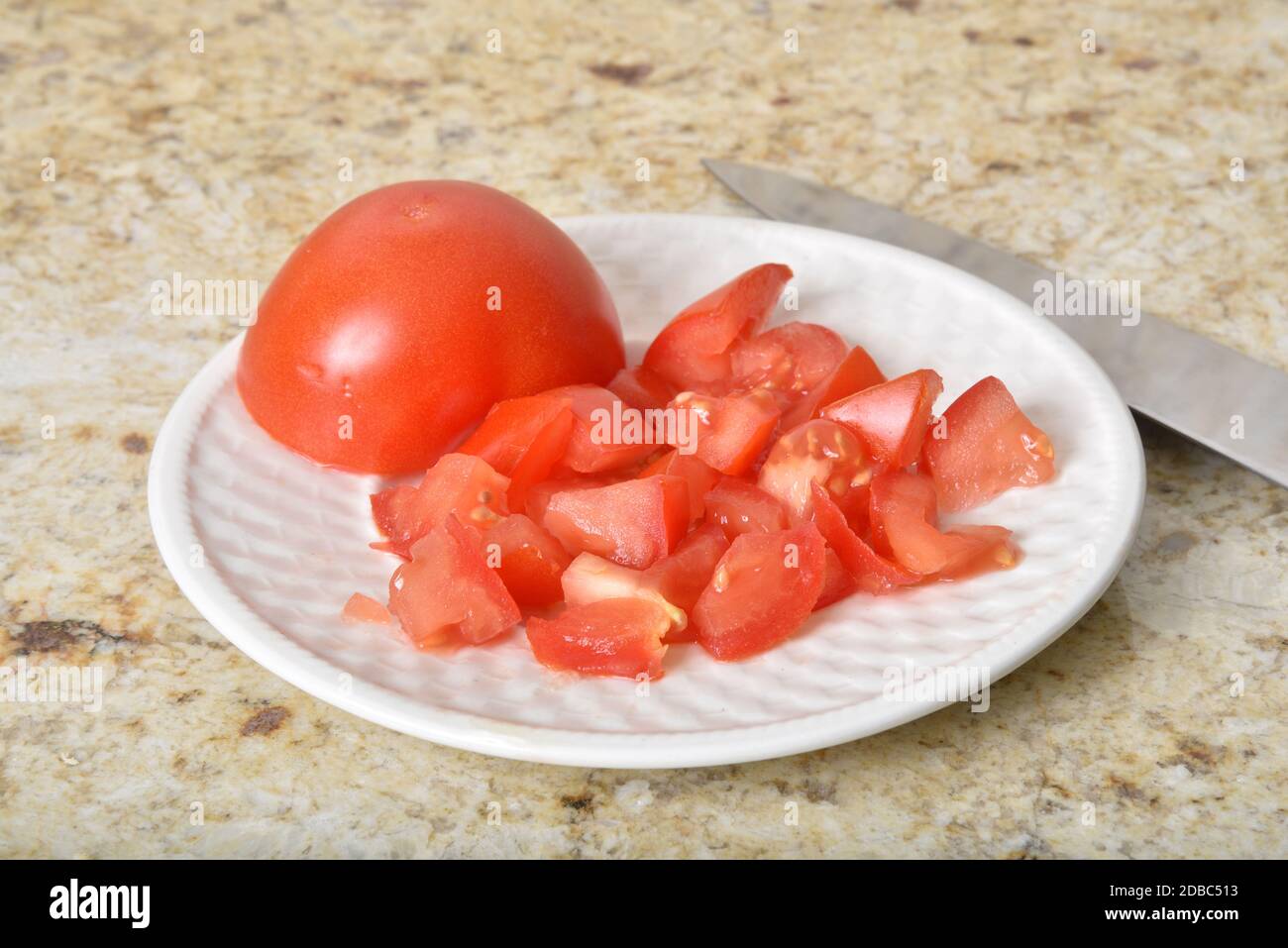A diced tomato on a small plate Stock Photo - Alamy