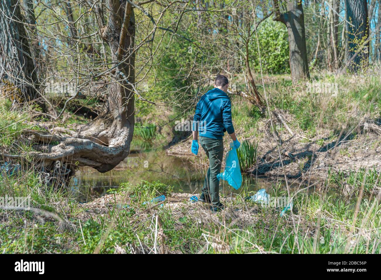 Collecting plastic in nature hi-res stock photography and images - Alamy