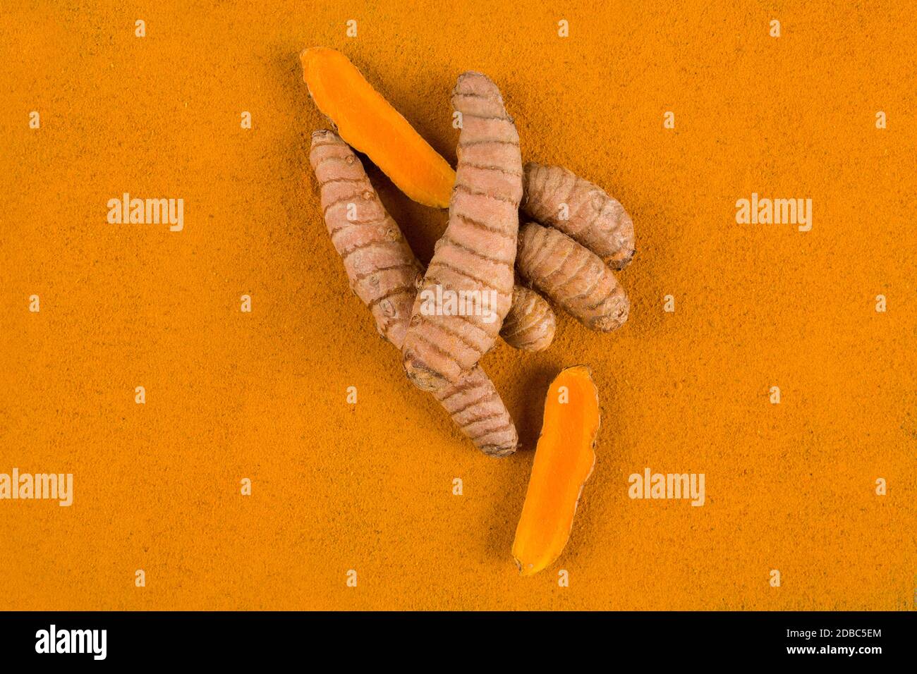 Curcumin root and turmeric spice background from above. Herbal medicine ...