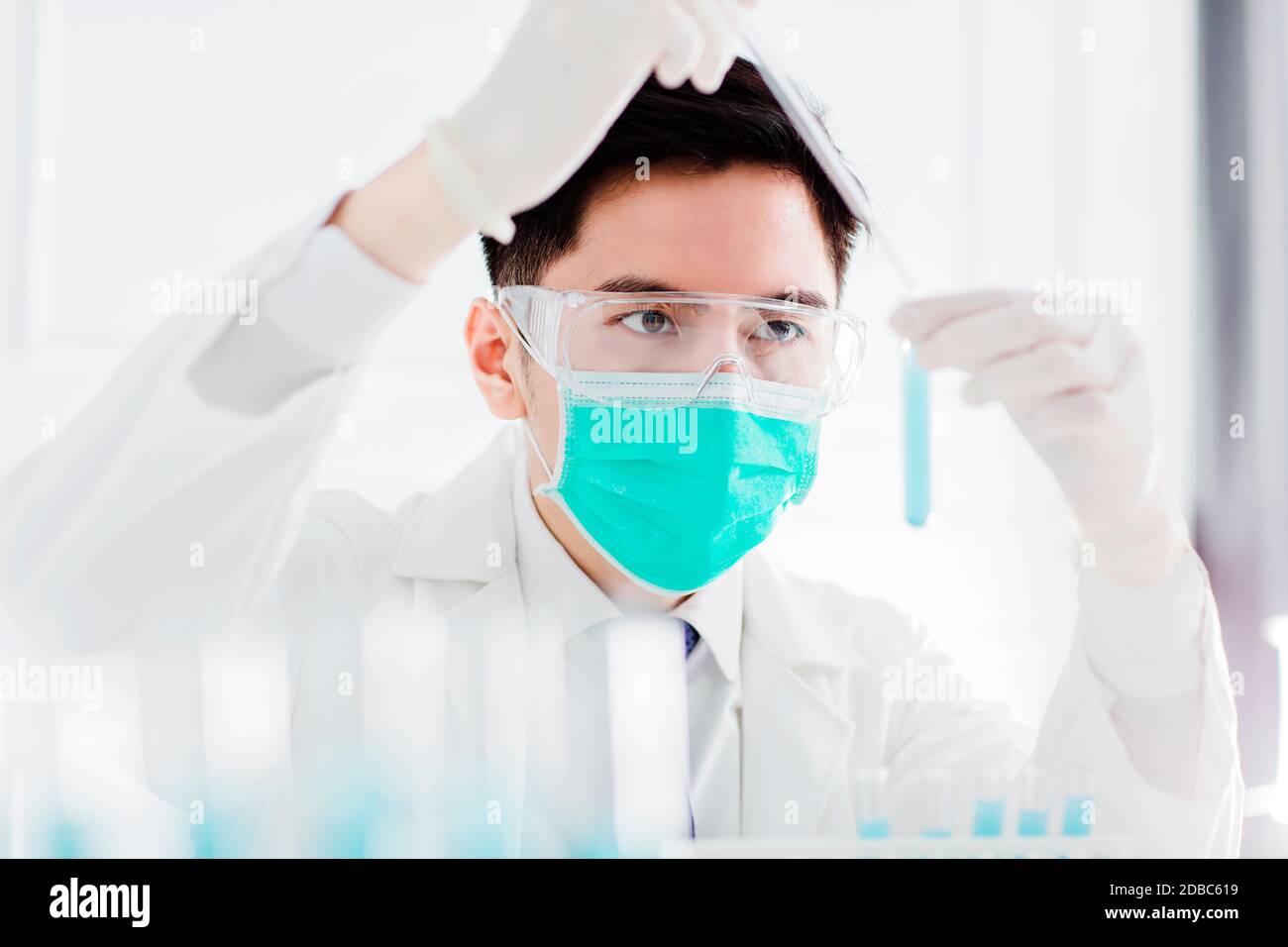 scientist in the laboratory working at lab with test tubes Stock Photo ...