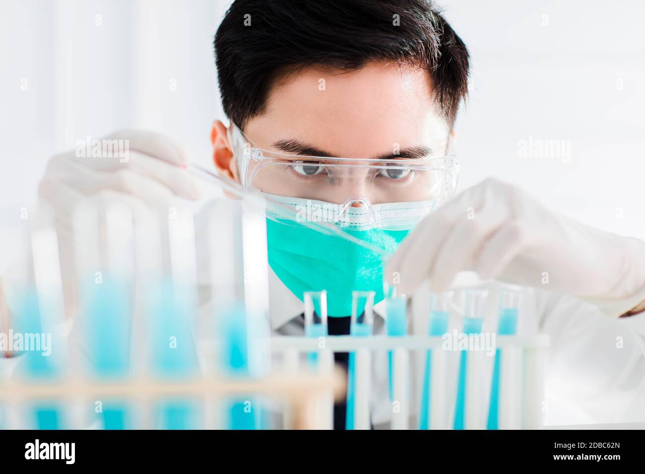 scientist in the laboratory working at lab with test tubes Stock Photo ...