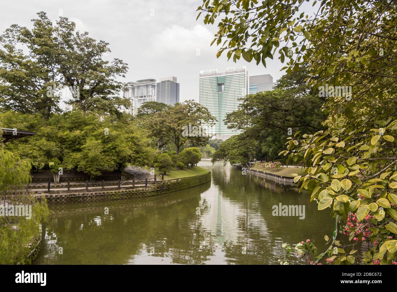 In the background a high rise panorama Perdana Botanical Gardens Lake ...