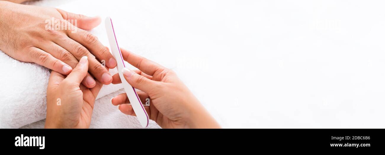 Man Manicure Filing And Nail Spa Therapy Stock Photo - Alamy