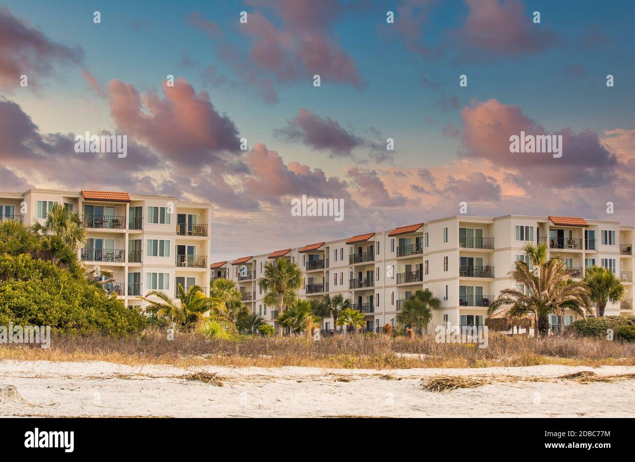 A nice three-story beach condominium complex Stock Photo - Alamy