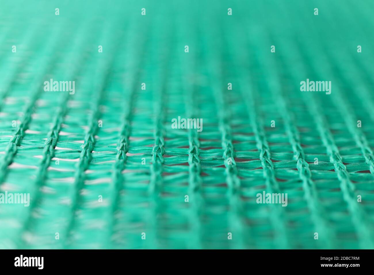 Green wired net surface with blurred background. Advertising backdrop ...