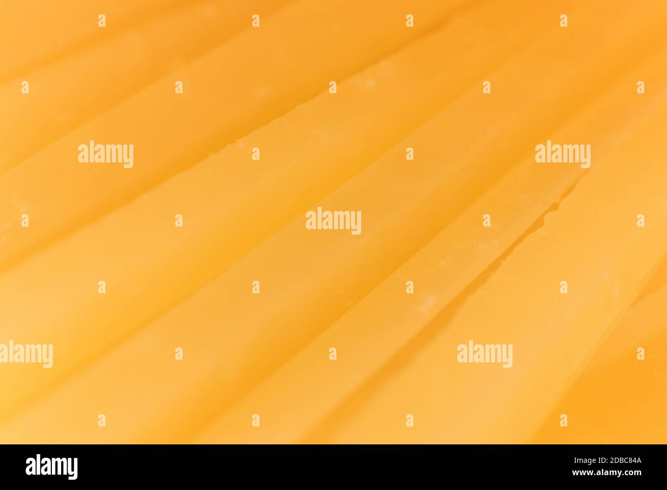 Solid cheese slices macro closeup. Background Texture Stock Photo - Alamy