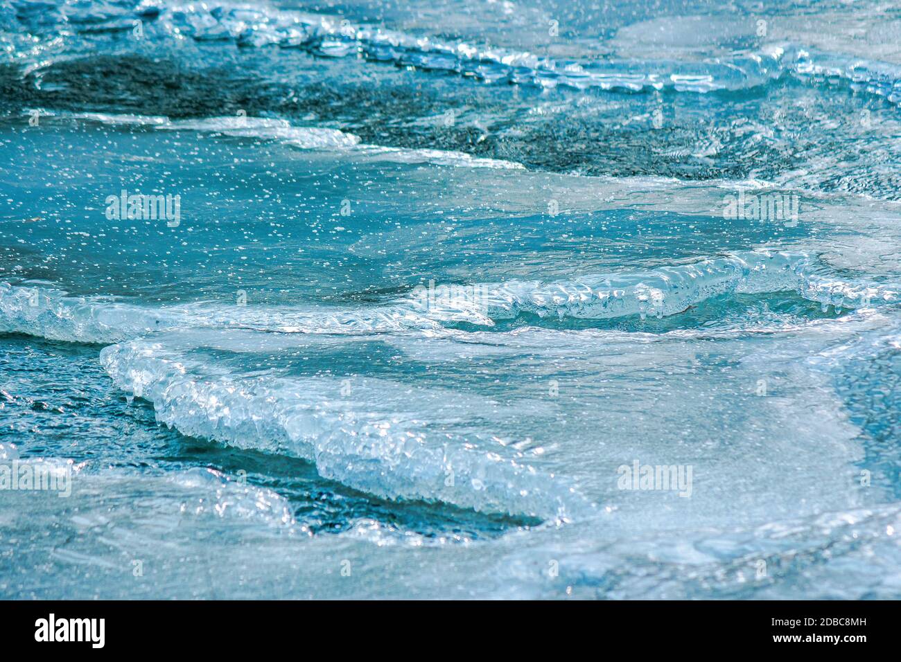 ice texture on the river. close up background. blue color in day light ...
