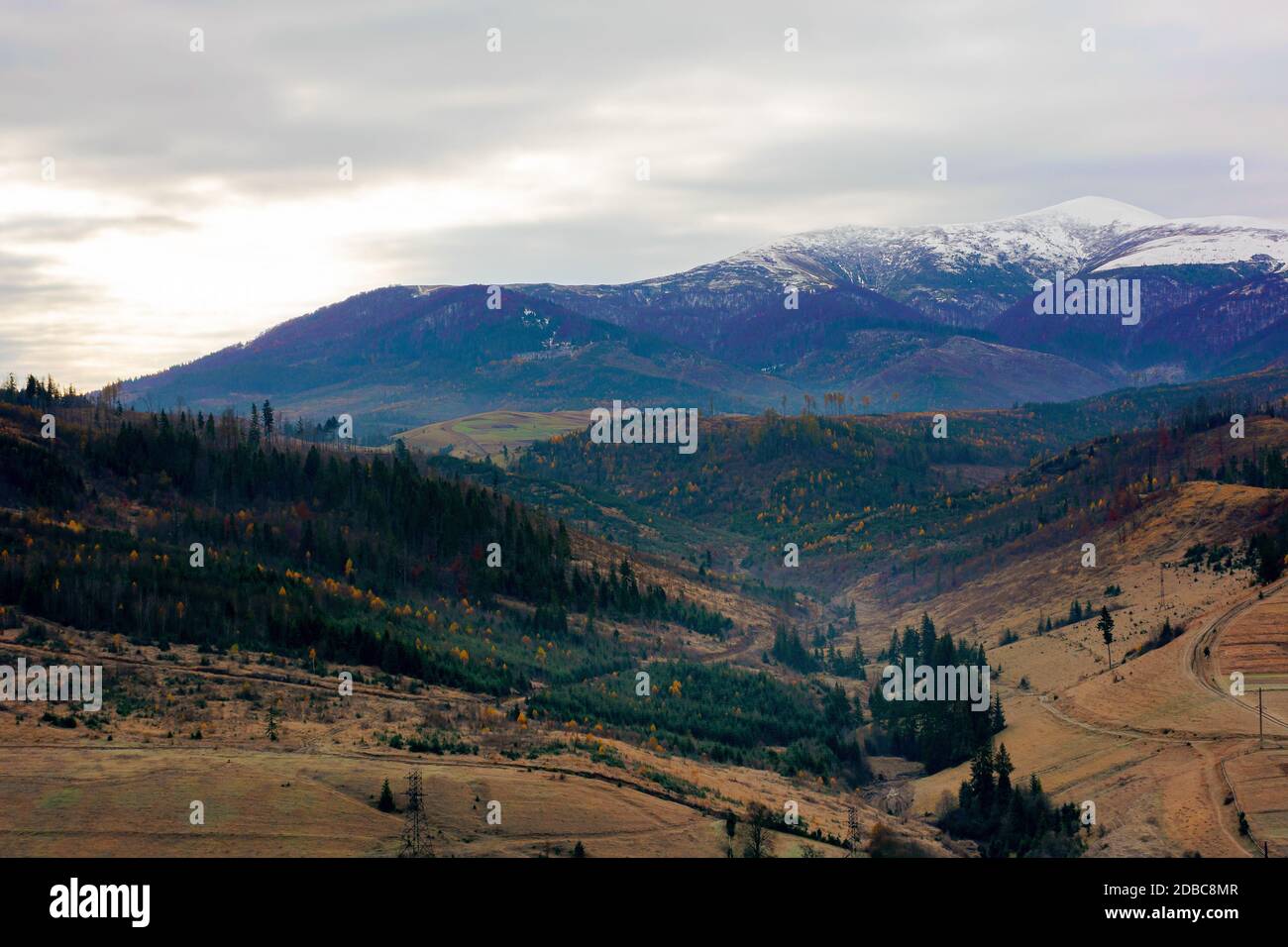 cold gloomy autumn morning in mountains. overcast sky above ridge with ...