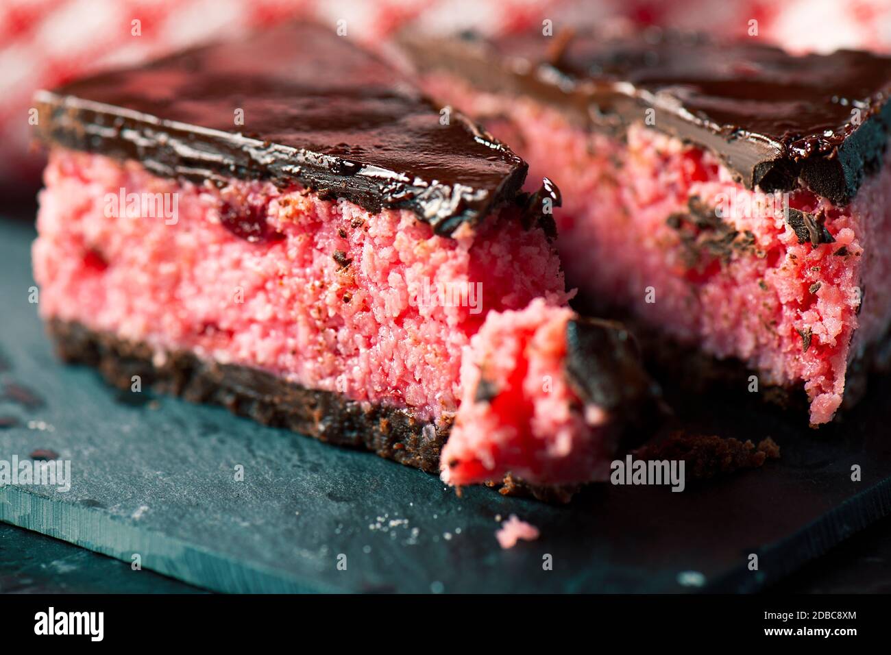 Choc cherry slice with coconut and chocolate, food background Stock ...