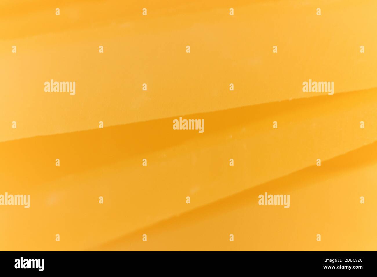 Solid cheese slices macro closeup. Background Texture Stock Photo - Alamy