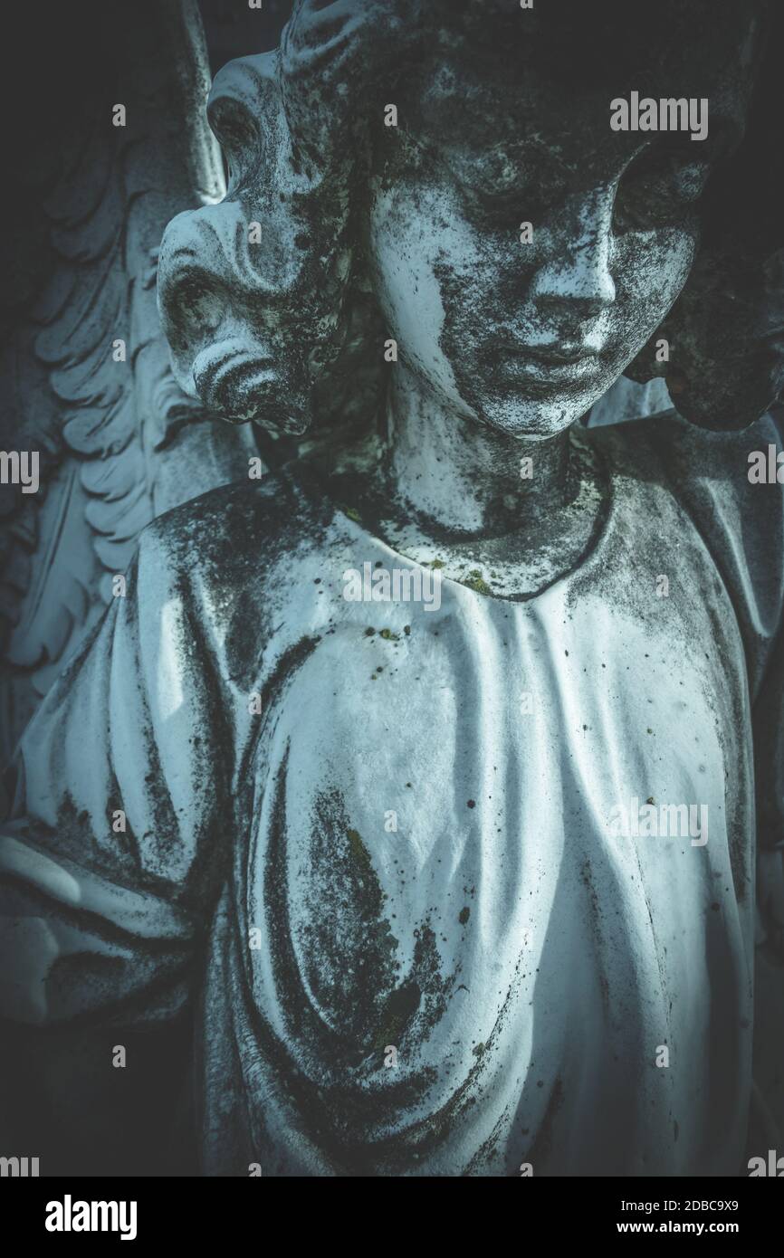 Antique stone statue of sad angel. Retro stylized. Religion, faith ...