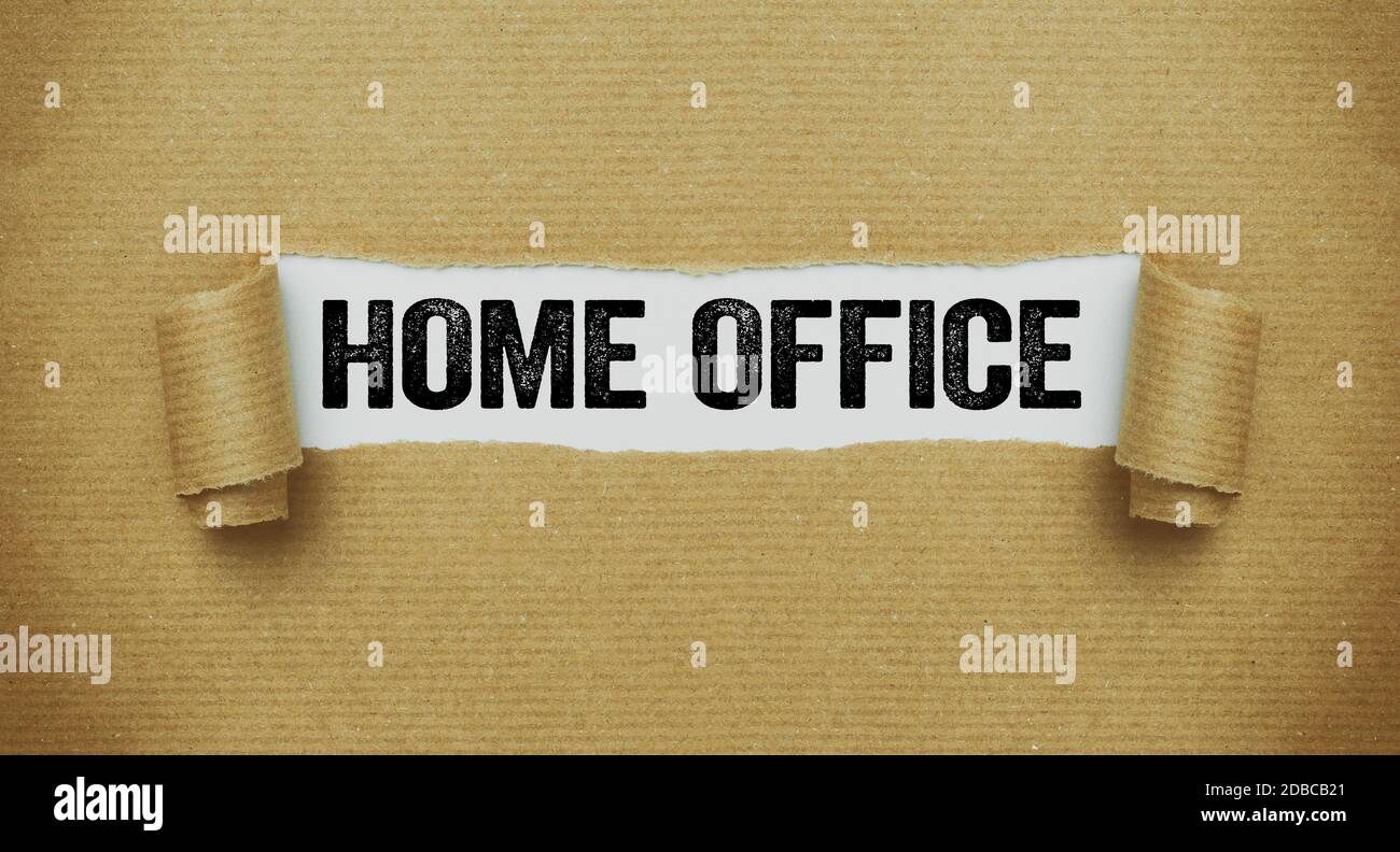 Torn paper revealing the words Home office Stock Photo - Alamy