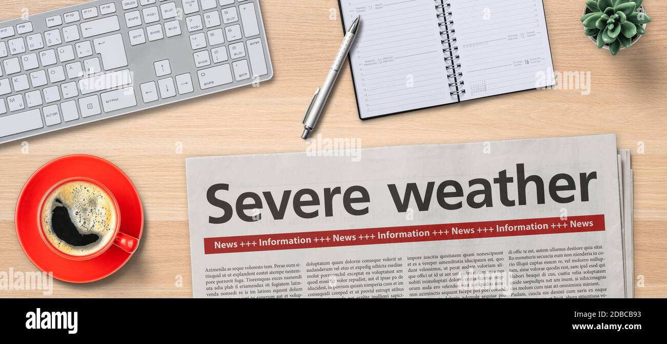 Newspaper on a desk - Severe weather Stock Photo - Alamy