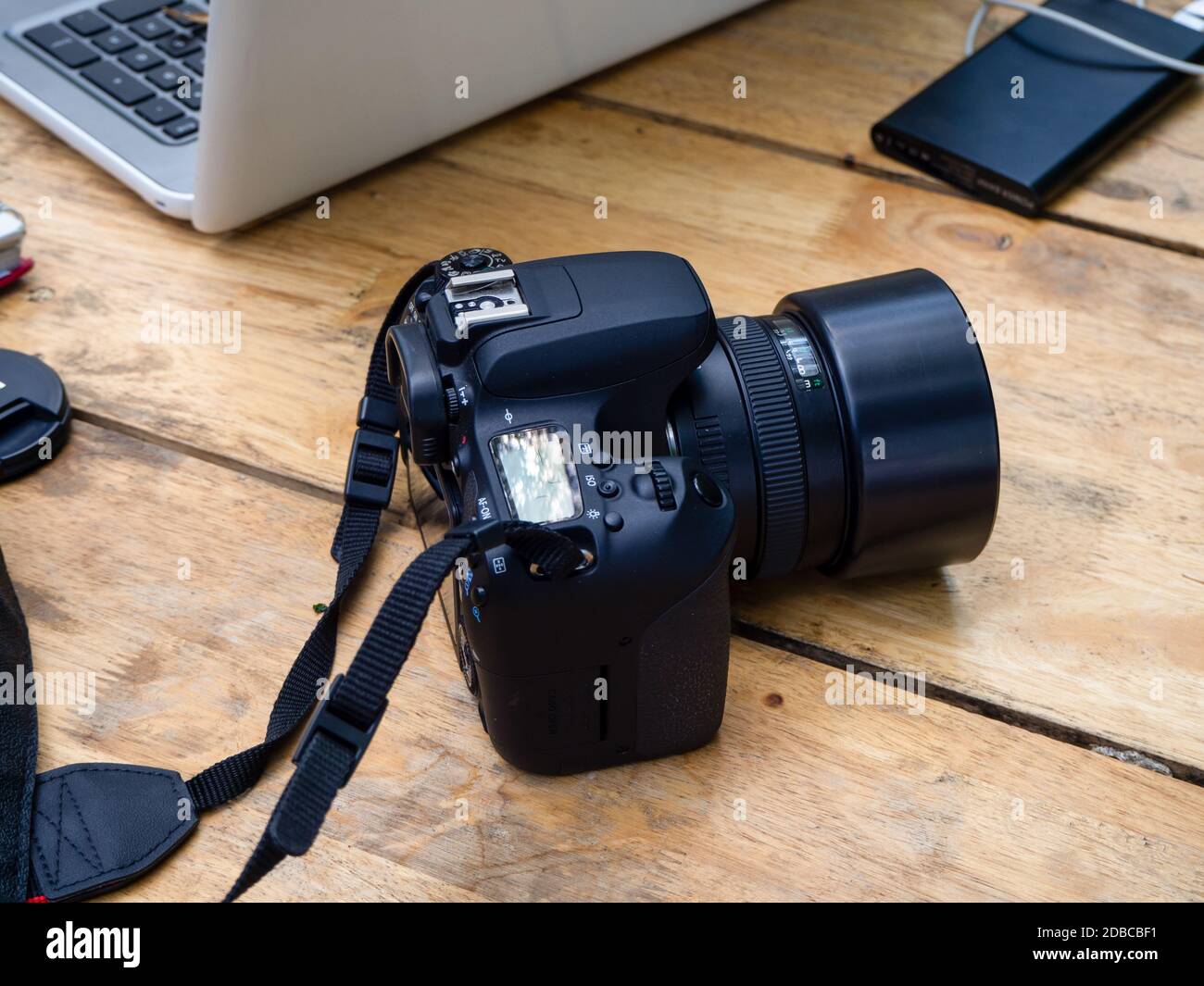 Wood photographter office desk table with digital camera and lens and ...