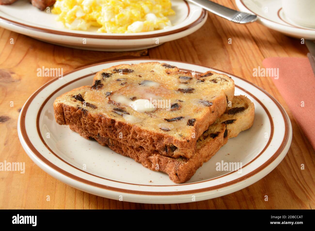 Hot buttered raisin toast with scrambled eggs Stock Photo - Alamy