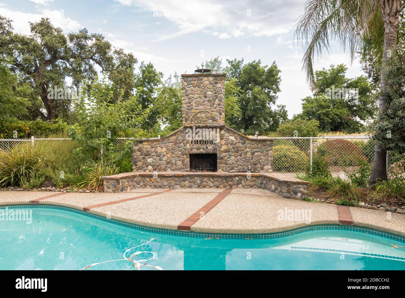 Northern California suburban villa backyard with pool and fireplace ...