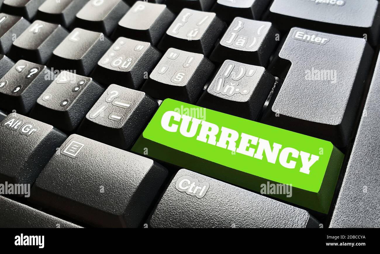 Black keyboard with one green key labeled by currency sign Stock Photo ...