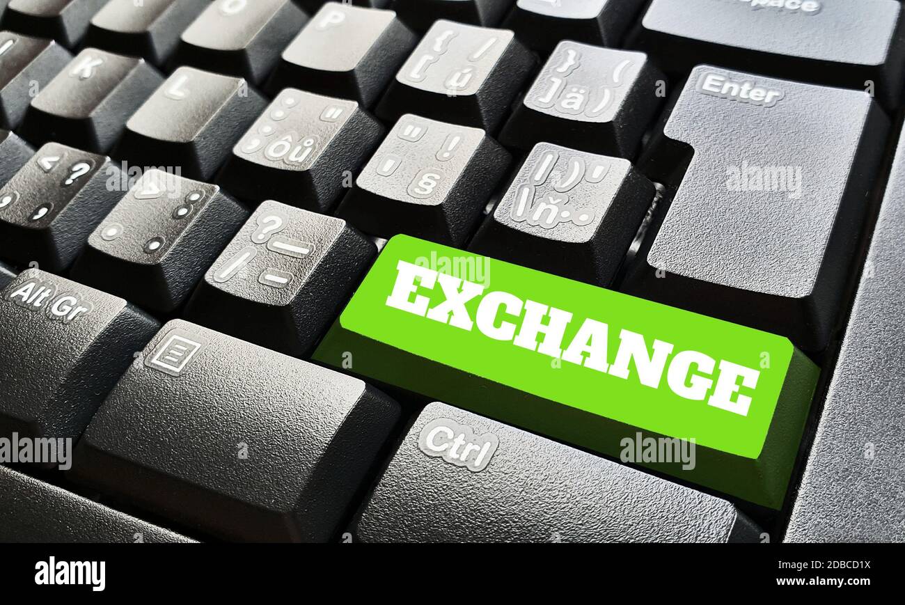 Black keyboard with one green key labeled by exchange sign Stock Photo ...