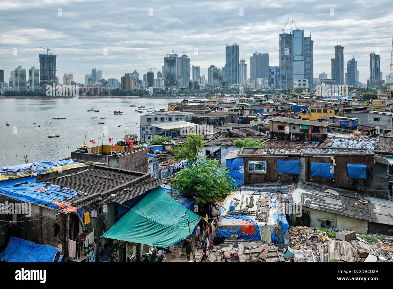 View of Mumbai skyline with skyscrapers over slums in Bandra suburb. Mumbai, Maharashtra, India ...