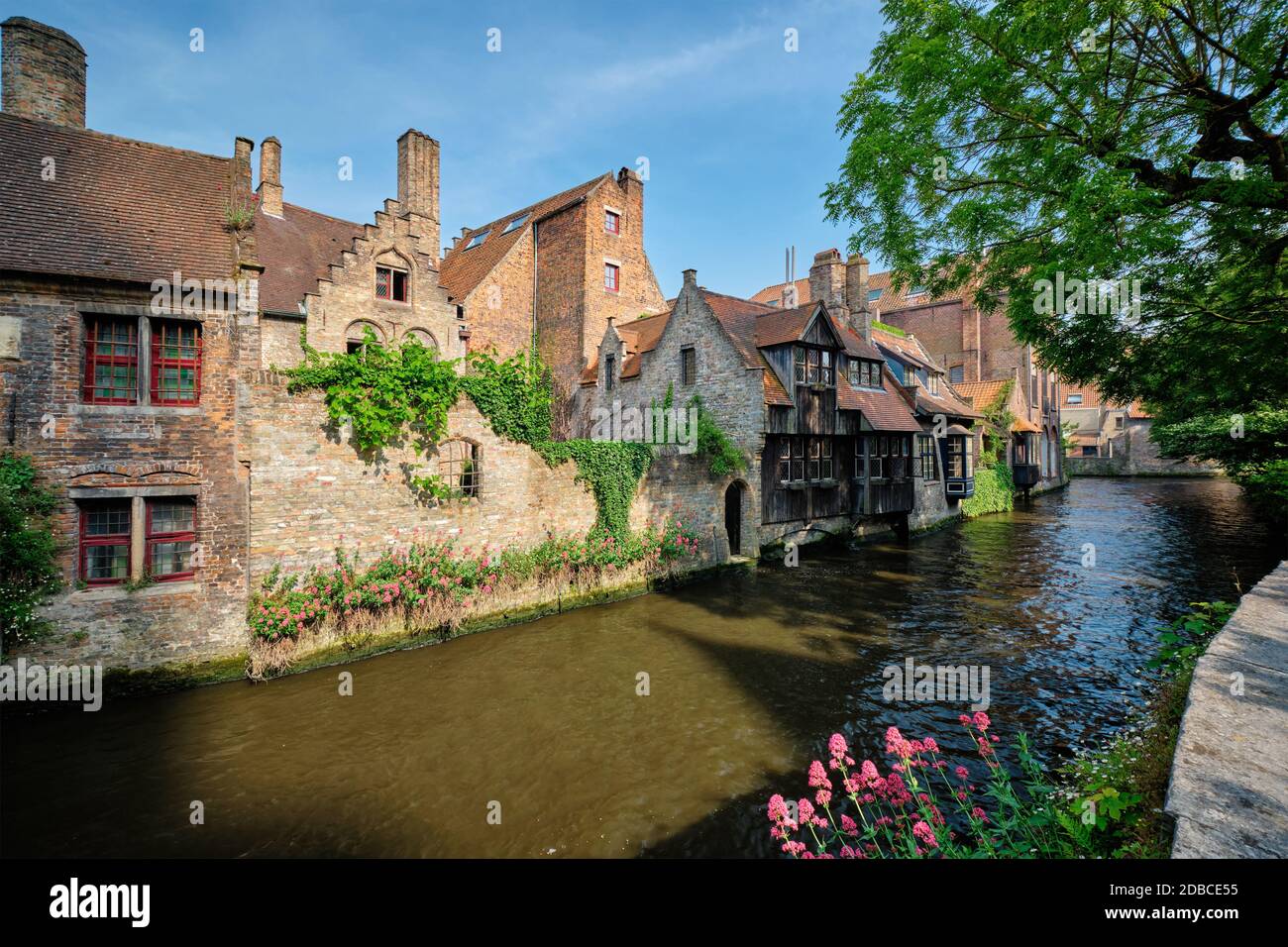 Canal between old houses of famous Flemish medieval city Brugge. Bruges ...
