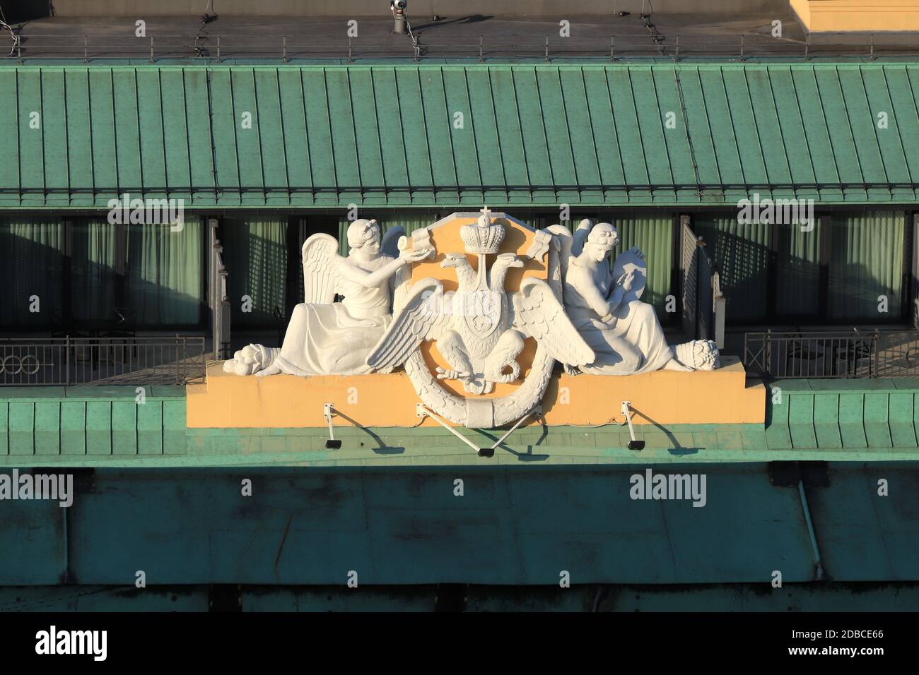 Gypsum figures of two angels about the symbol of the Russian coat of ...