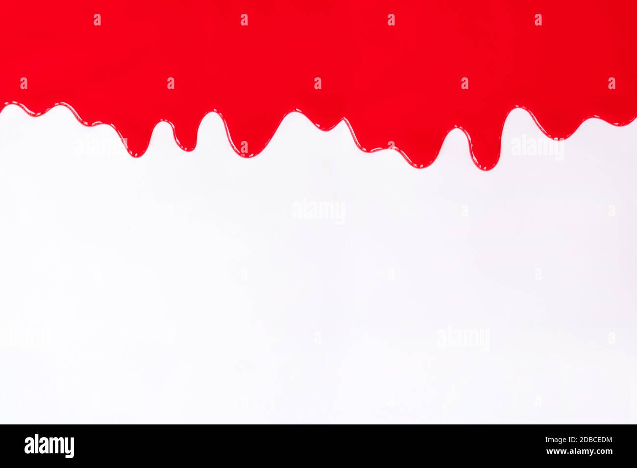 Red paint dripping on a white background Stock Photo - Alamy